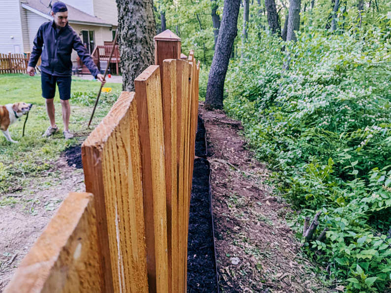 LAYING A MULCH BORDER UNDER OUR FENCE - Grove House Reno